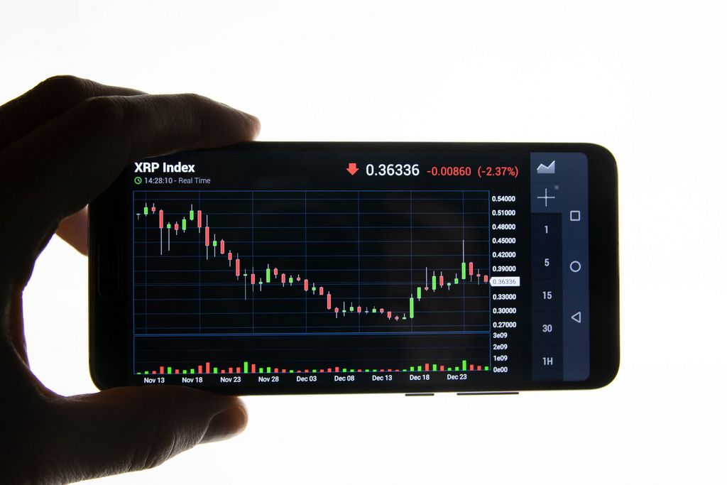 Man Checking Ripple Price Graph Chart On Mobile Phone Screen Creative